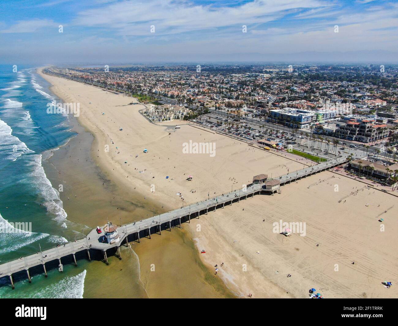 Aerial view of Huntington Pier, beach and coastline during sunny summer ...