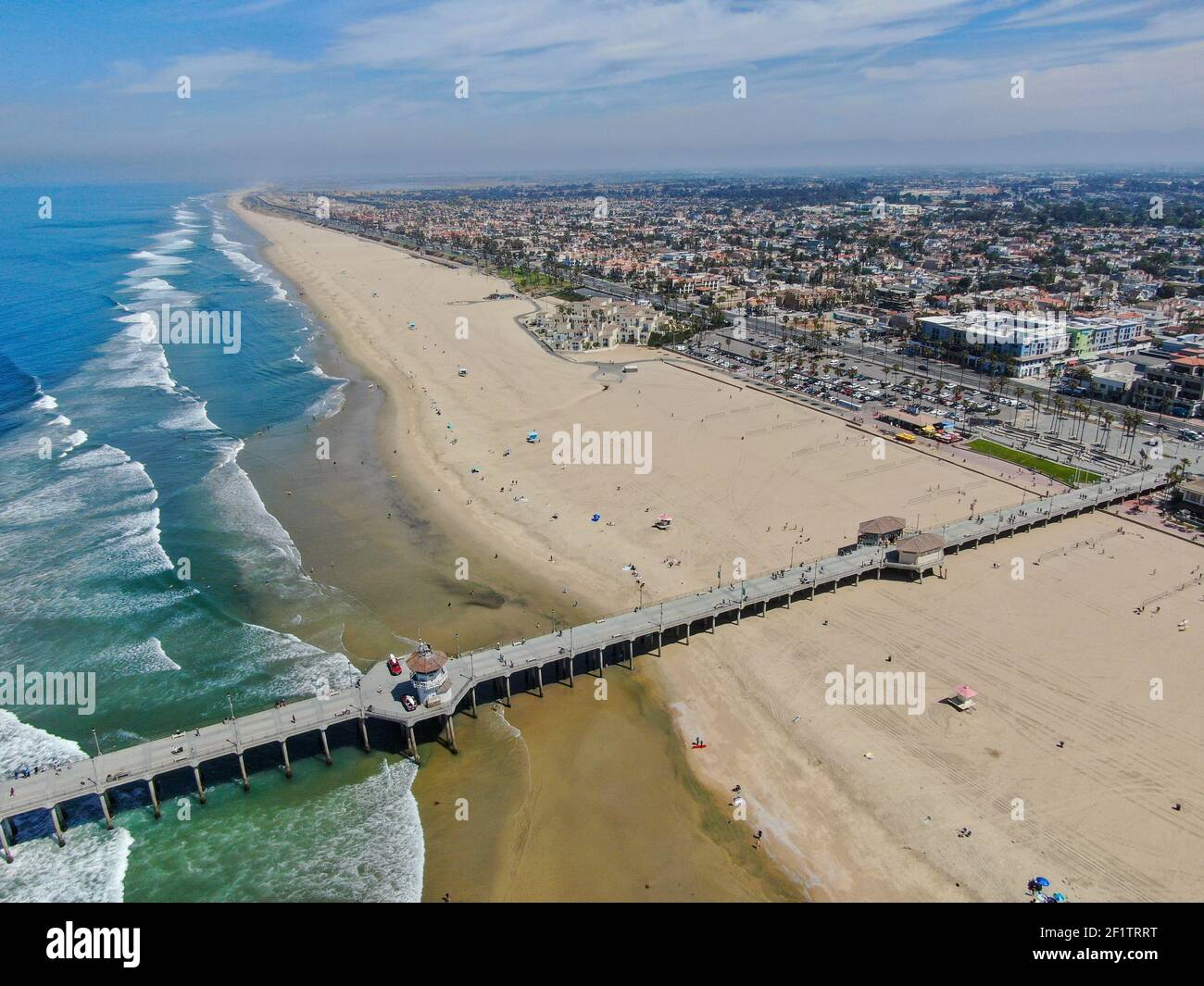 Aerial view of Huntington Pier, beach and coastline during sunny summer ...