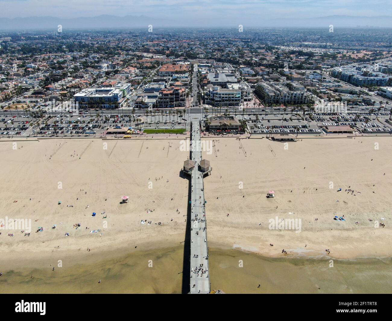 Aerial view of Huntington Pier, beach and coastline during sunny summer ...