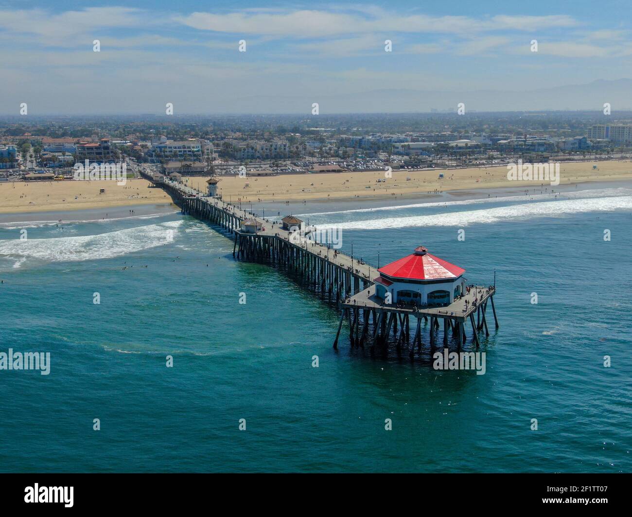 Aerial view of Huntington Pier, beach and coastline during sunny summer ...