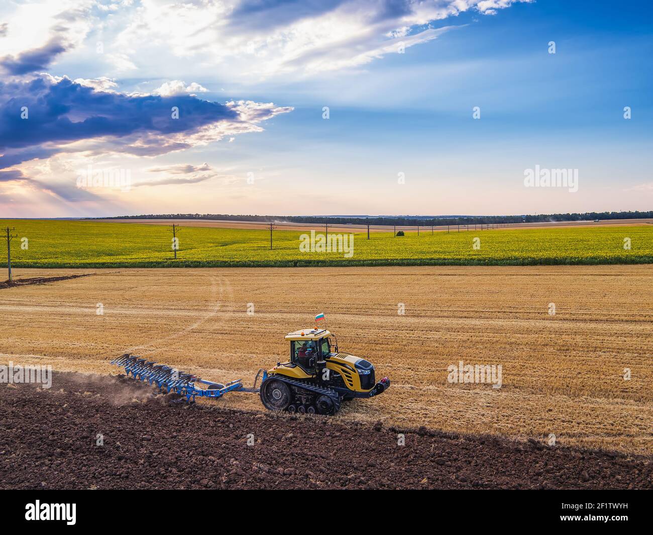 Tractor plowing the fields , agricultural landscape Stock Photo - Alamy