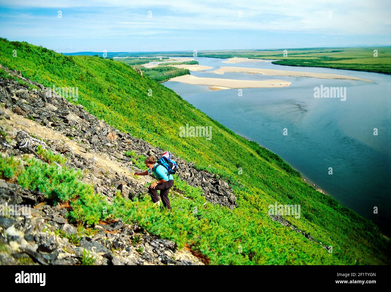 American tourist hiking above the Belaya River, Chukchi Peninsula ...