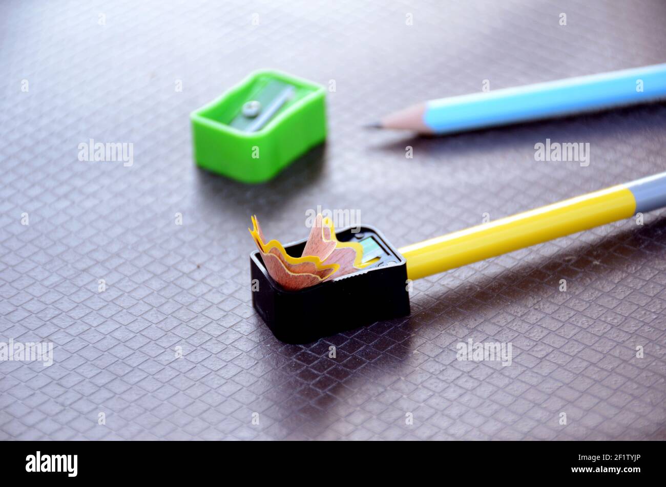 A closeup shot of a yellow pencil getting sharpened Stock Photo - Alamy