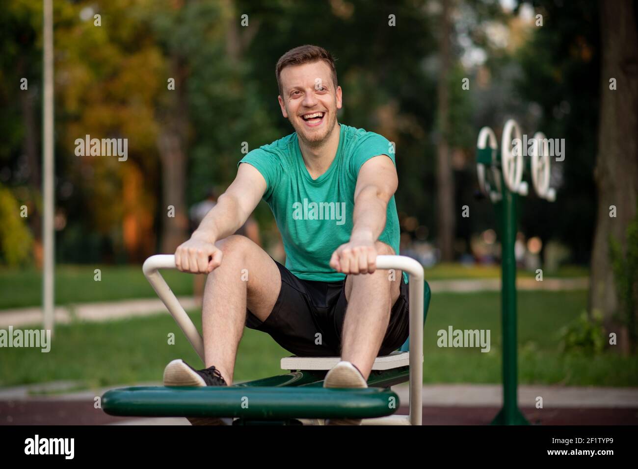 Male on rowing machine hi-res stock photography and images - Alamy