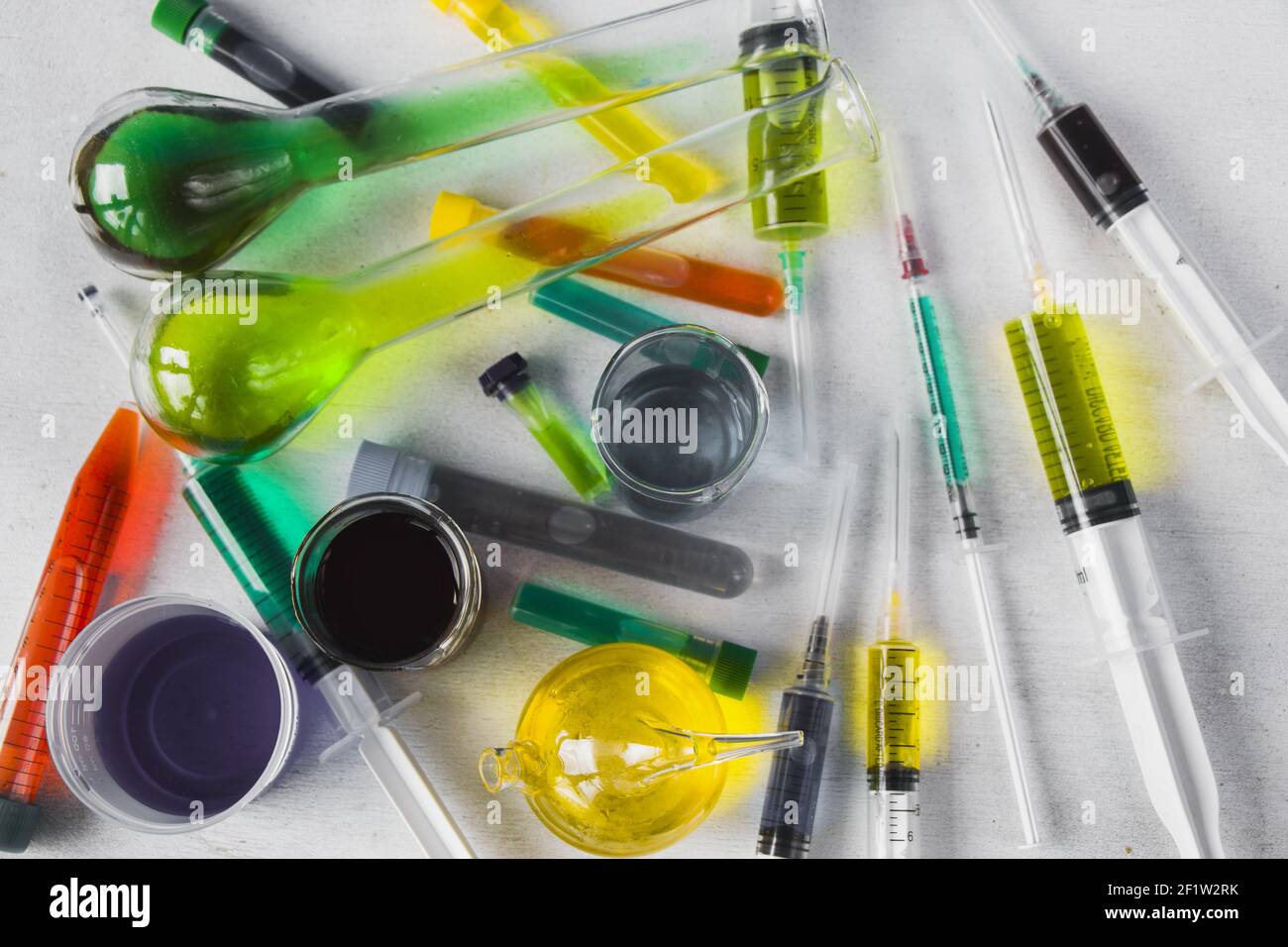 A top view of different chemicals in flasks, beakers, tubes, and ...