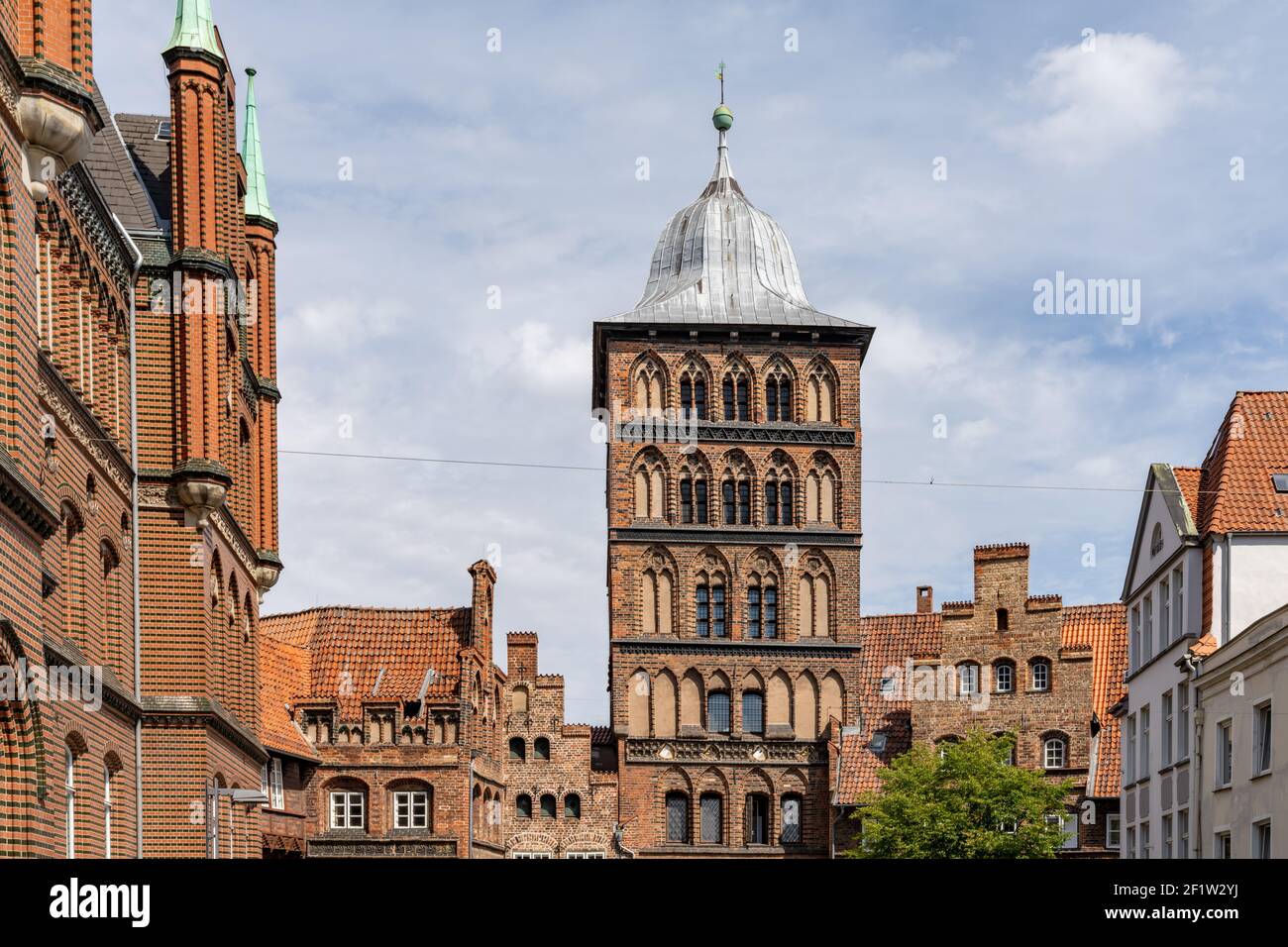 Historic red brick buildings and city gate guard tower in the old town ...