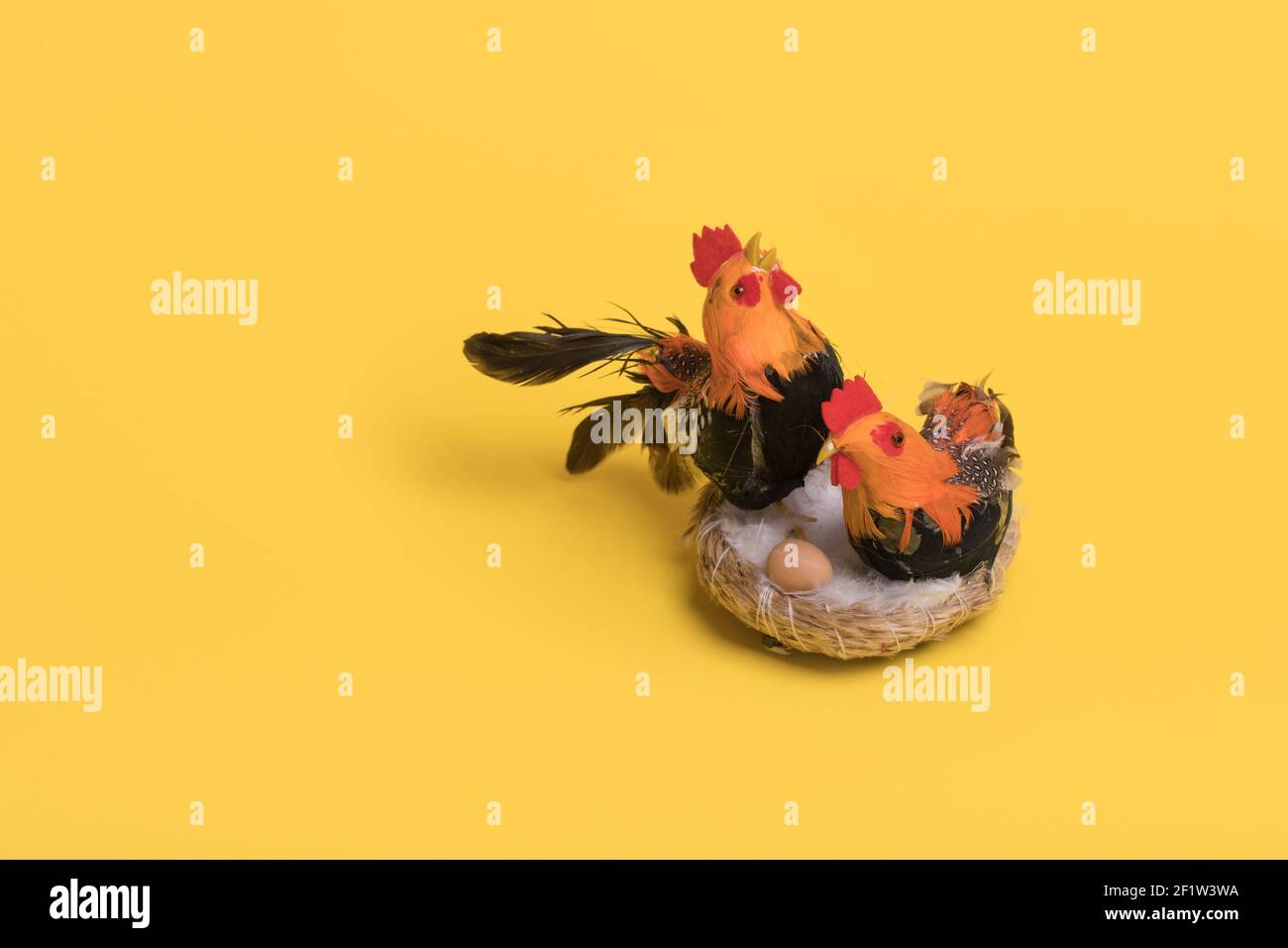 Rooster with hen and egg on trendy yellow background.Creative minimal ...
