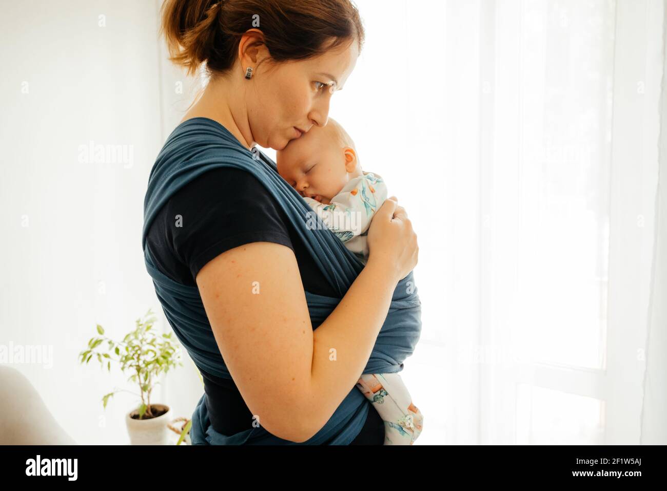 Mother newborn sling hi-res stock photography and images - Alamy