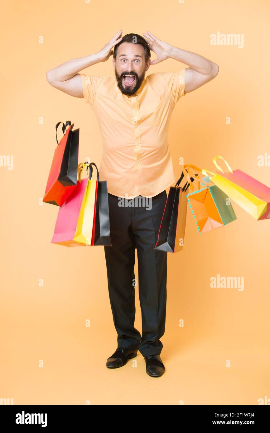 Shocking discount. Man shouting face dropping shopping bags. Guy ...