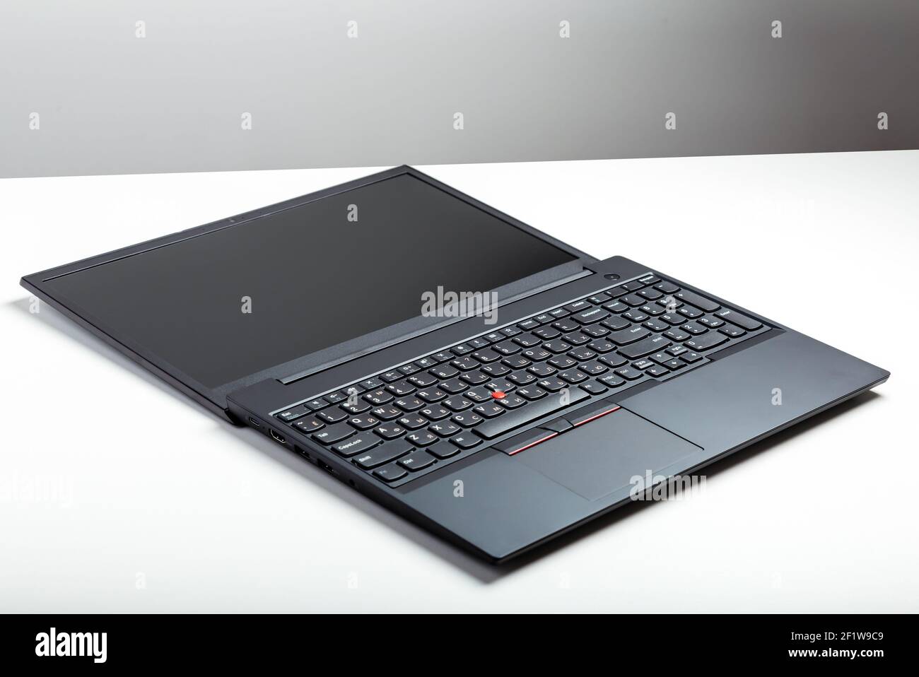 Convertible laptop open. Empty open laptop with mockup on white desk ...