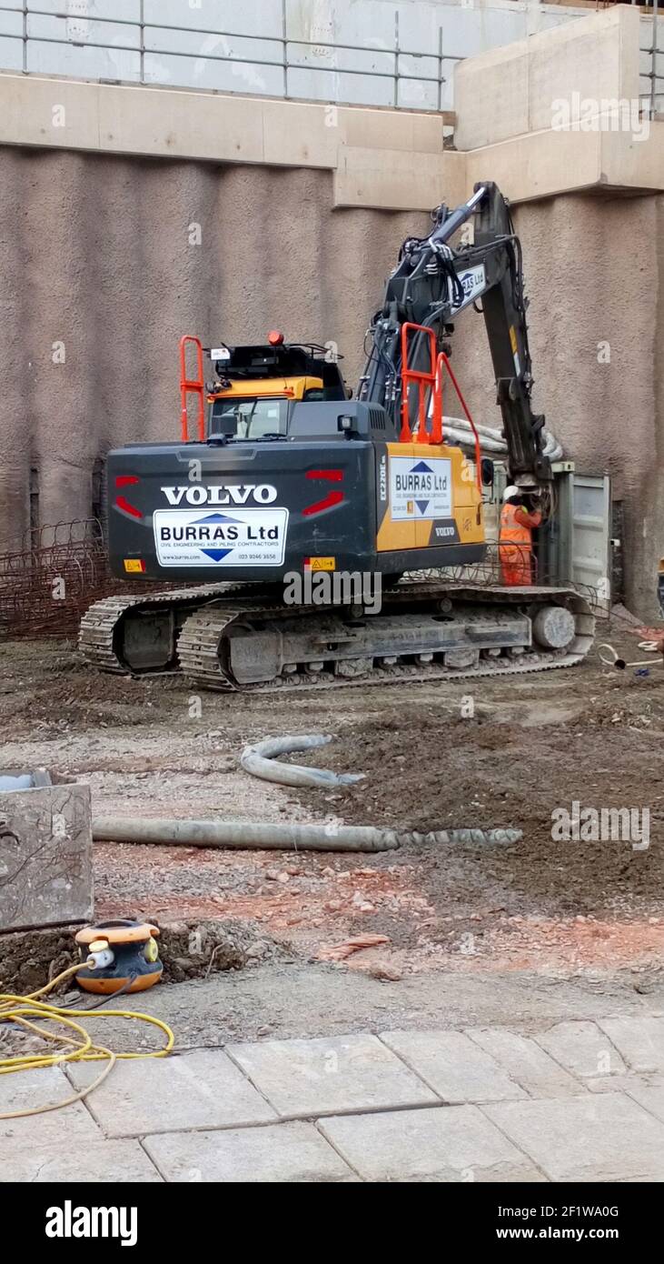 A Volvo EC200E crawler excavator in a building site, Torwood Street ...