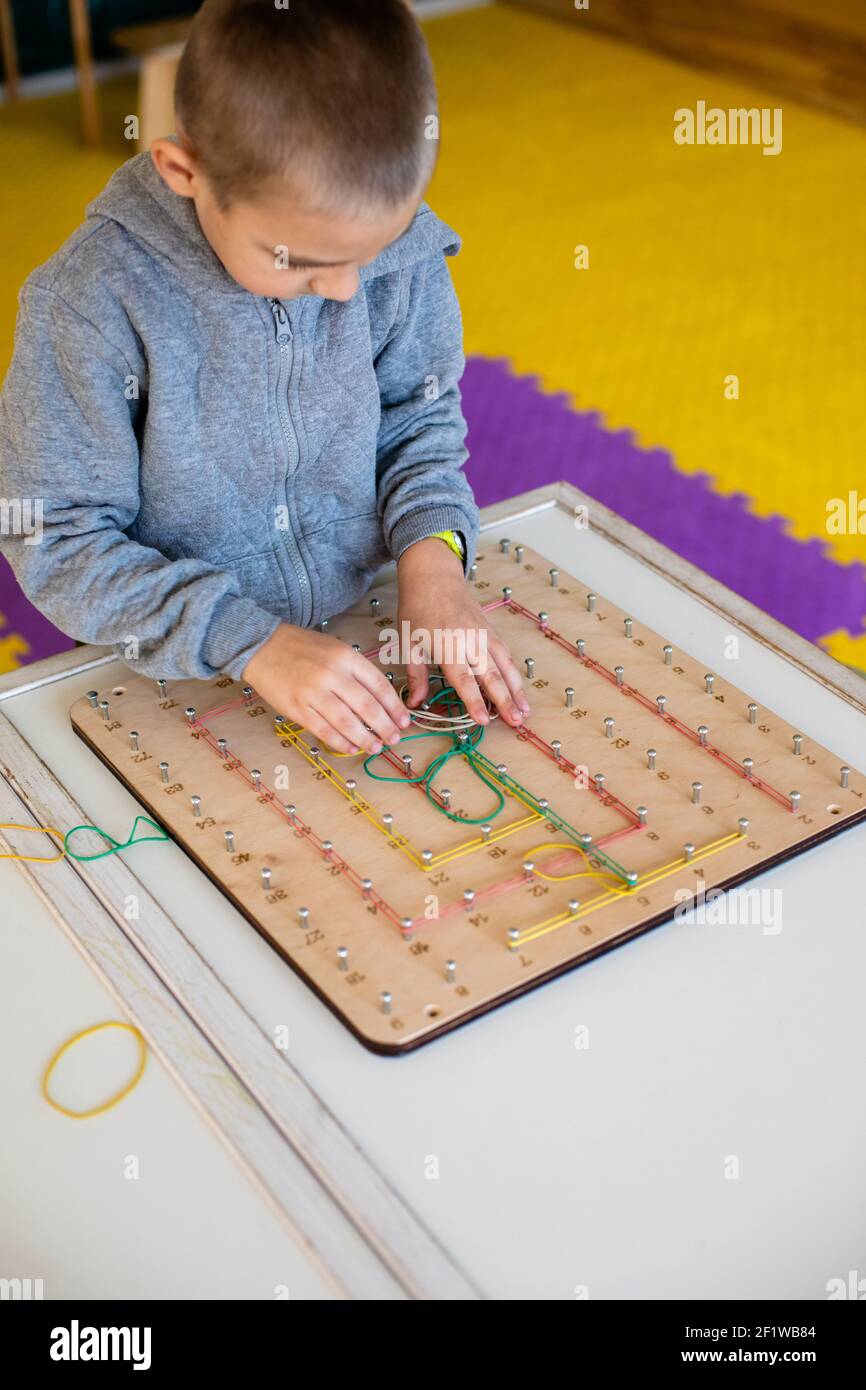 Exploring basic math and geometry concepts with geoboard Stock Photo ...