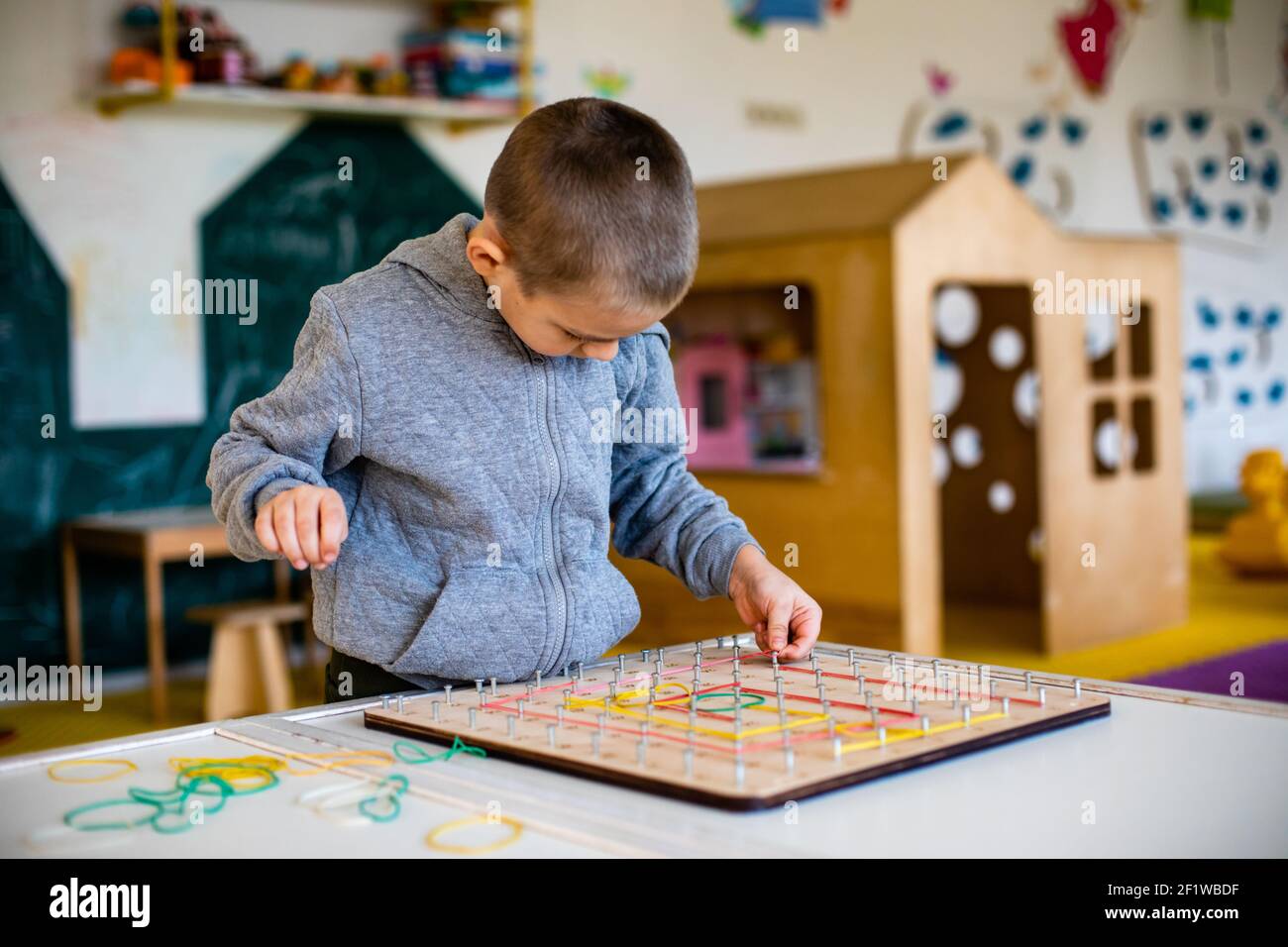 Exploring basic math and geometry concepts with geoboard Stock Photo ...