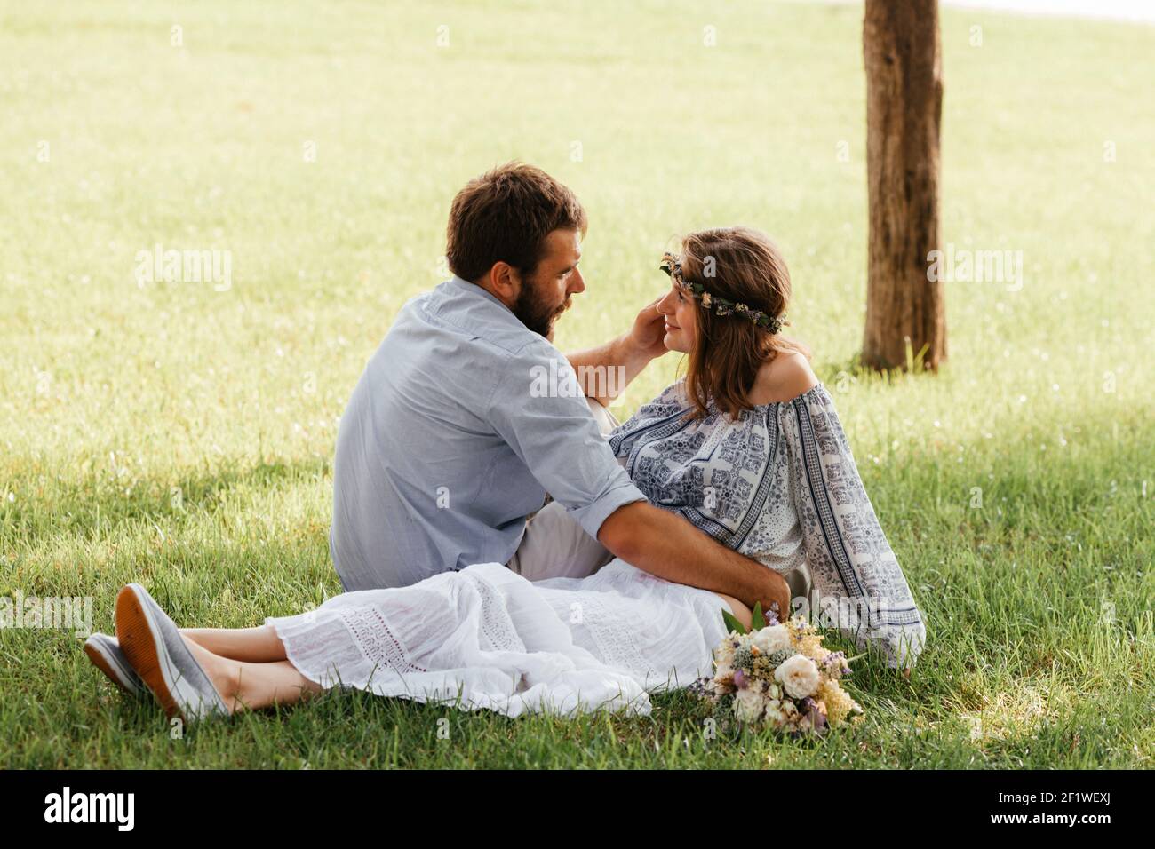 Eclectic rustic wedding couple. Intimate ceremony at backyard Stock ...