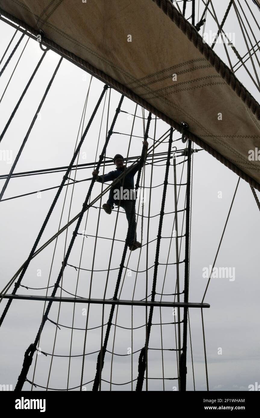 A person climbing the rigging on the HMS Bounty, a 180-foot (54 meter ...