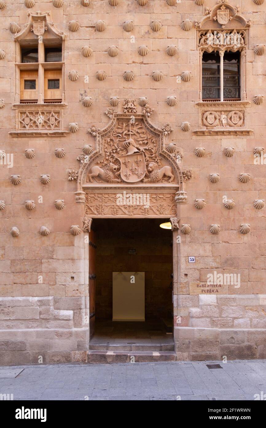 Detail of a door and two windows at Casa de las Conchas in Salamanca ...