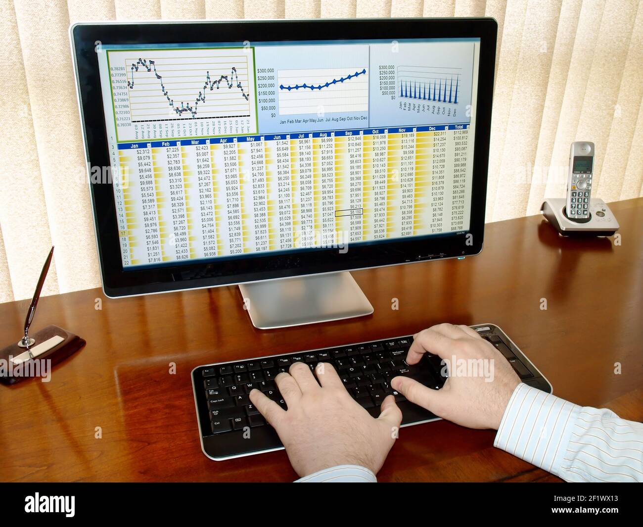 Analizing data on computer Stock Photo - Alamy