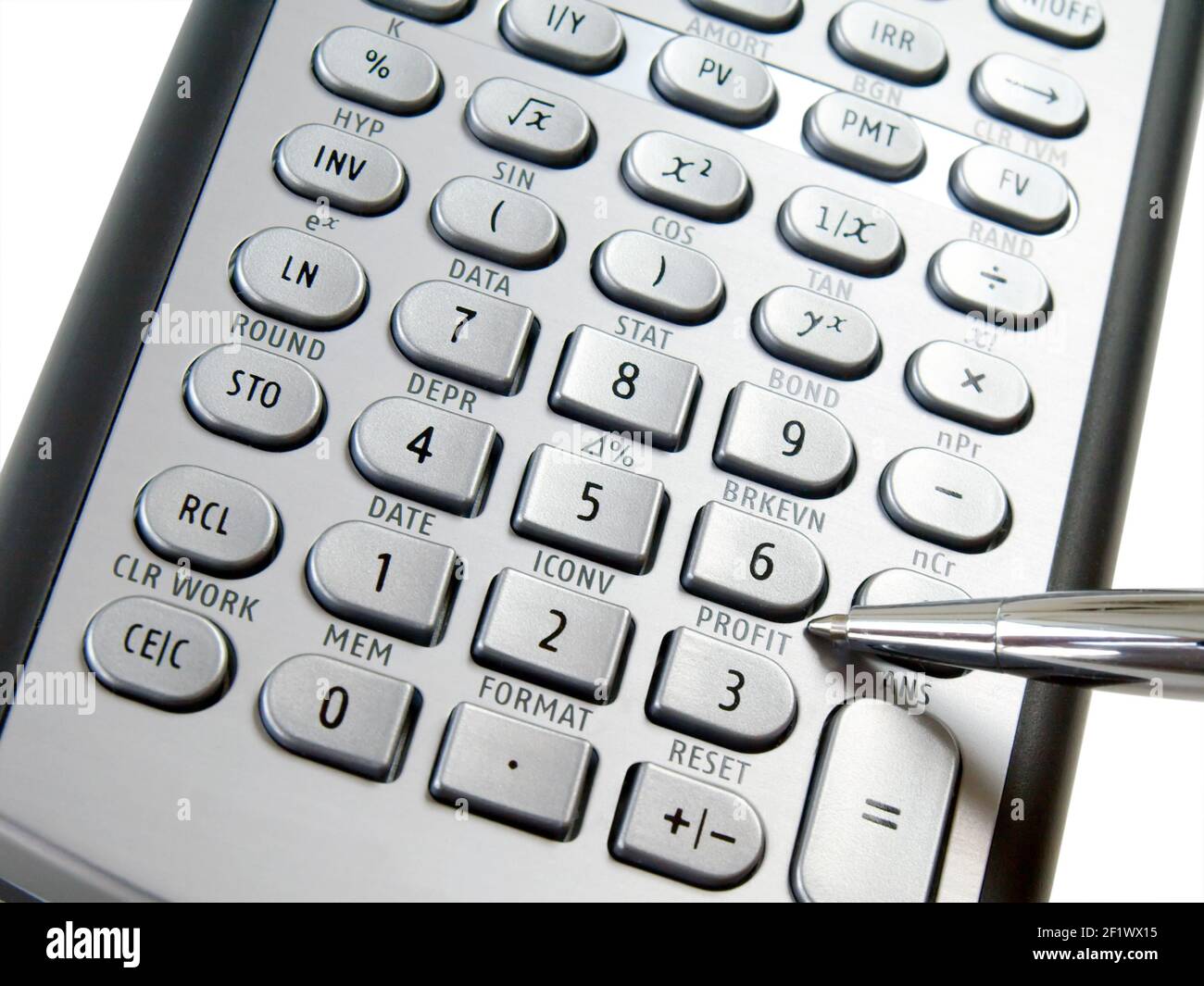 Silver calculator and pen Stock Photo - Alamy