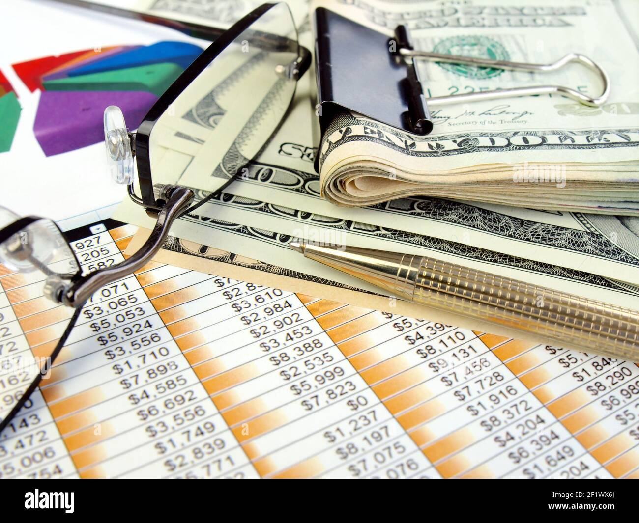 Bills on the table with financial data Stock Photo - Alamy