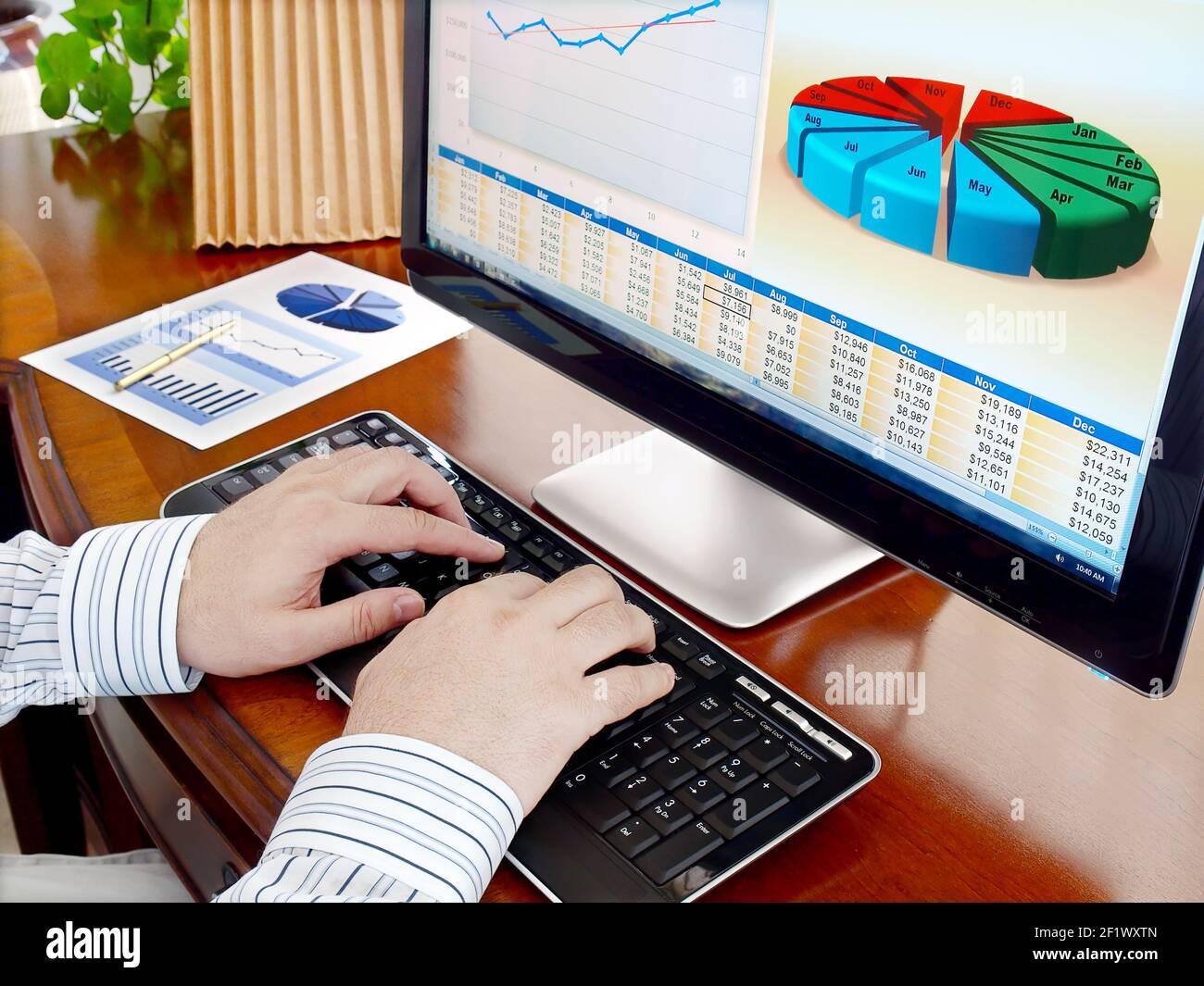 Analyzing data on computer Stock Photo - Alamy
