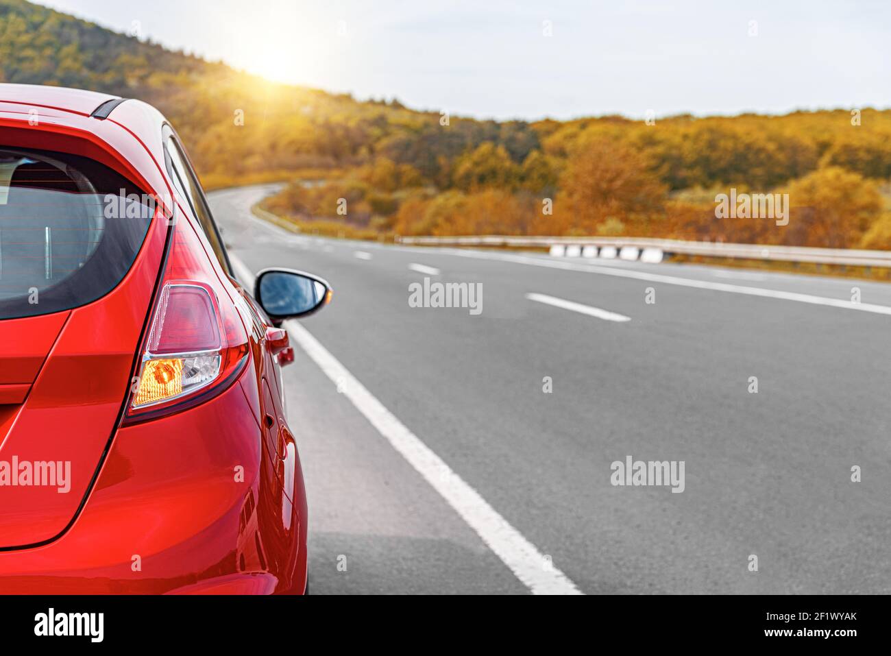 Red car on the side of the highway Stock Photo - Alamy