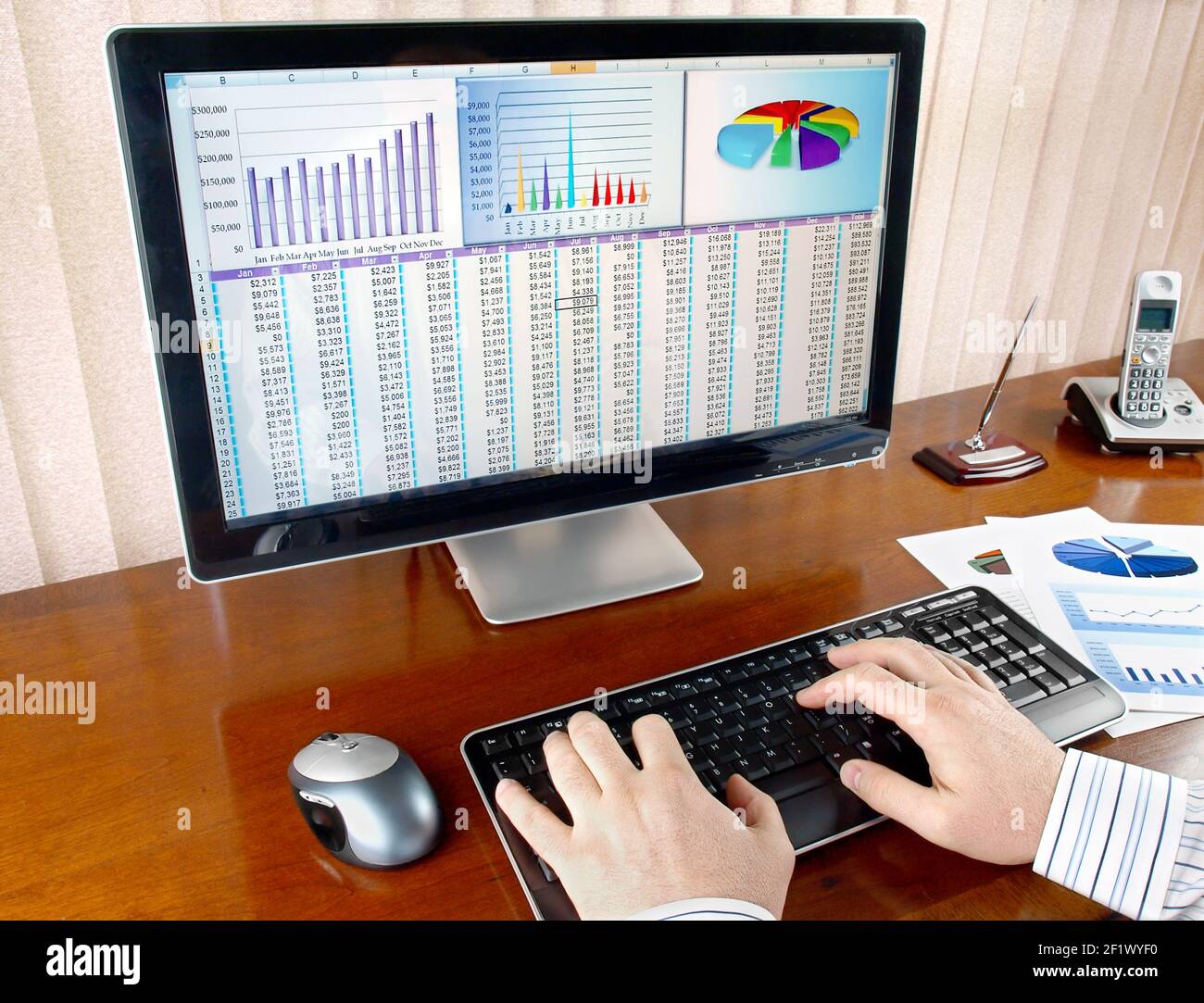 Analyzing data on computer Stock Photo - Alamy