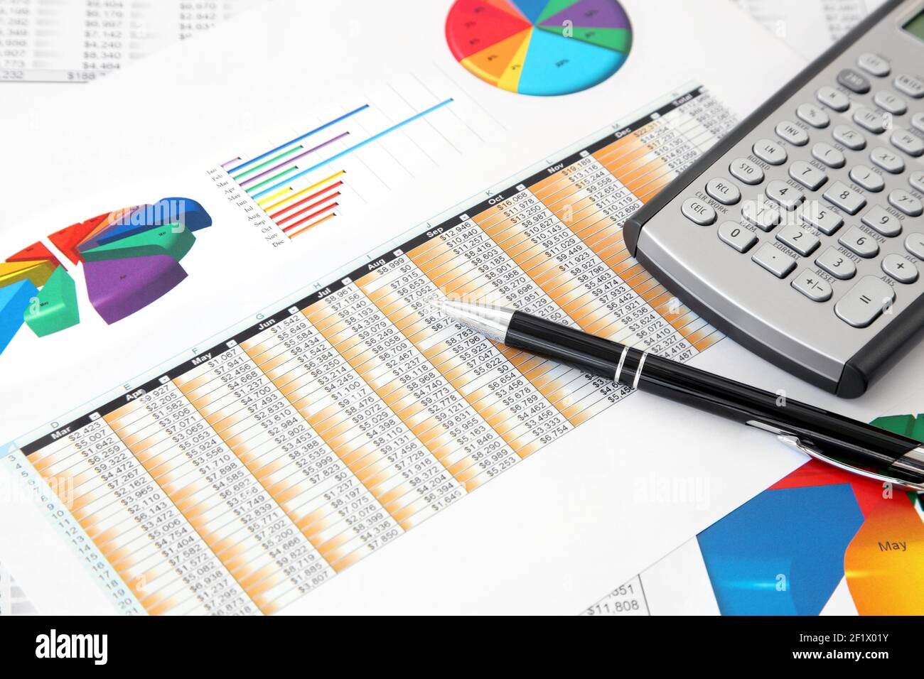 Investment Charts, Calculator and Pen Stock Photo - Alamy