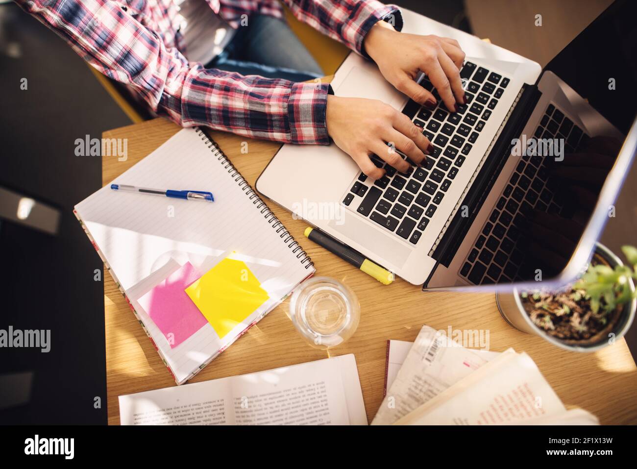 Top view of hardworking highschool student girl doing homework on the ...