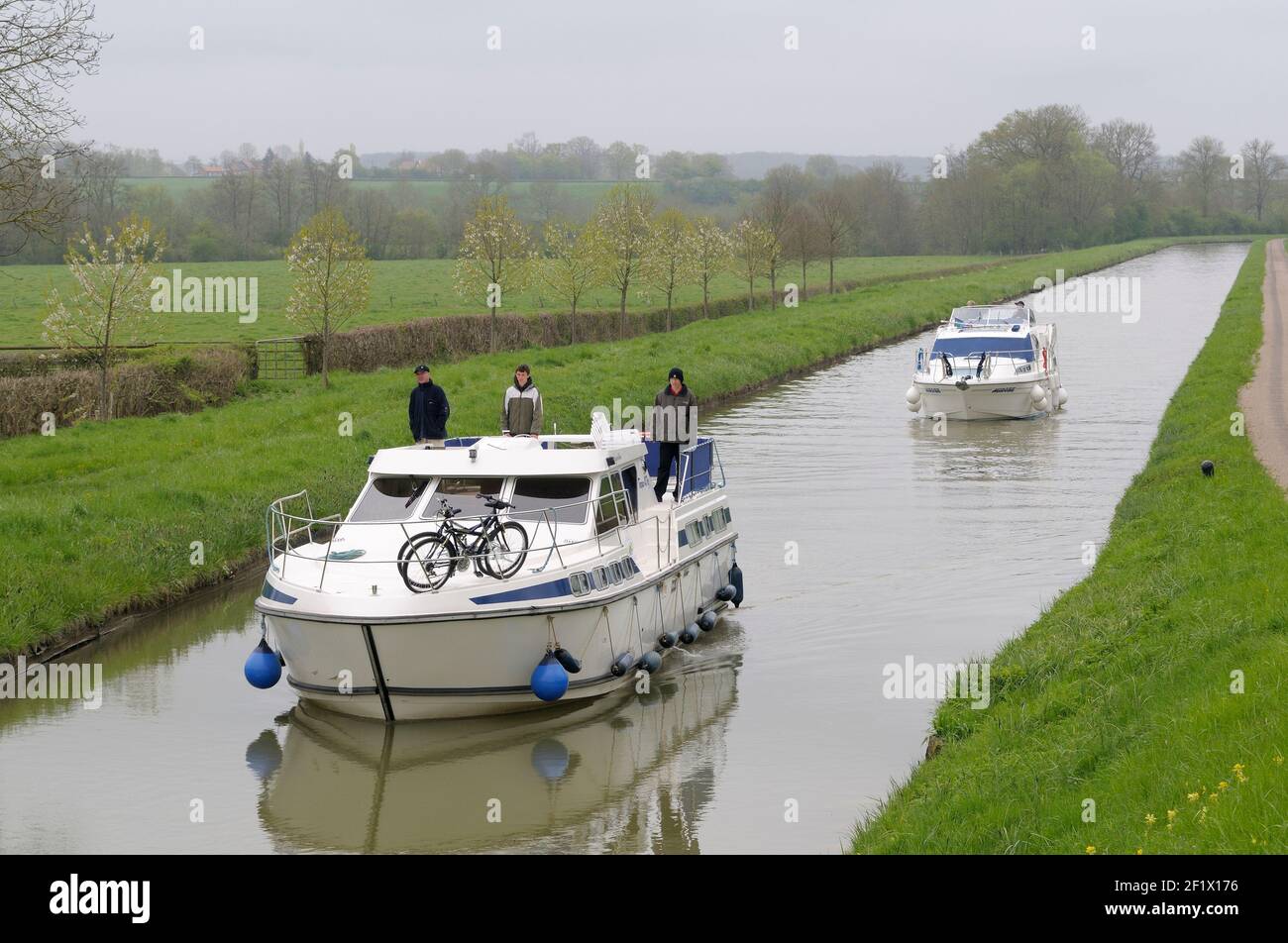 Clipper canal boats on a peaceful Nivernais Canal, Burgundy, France ...