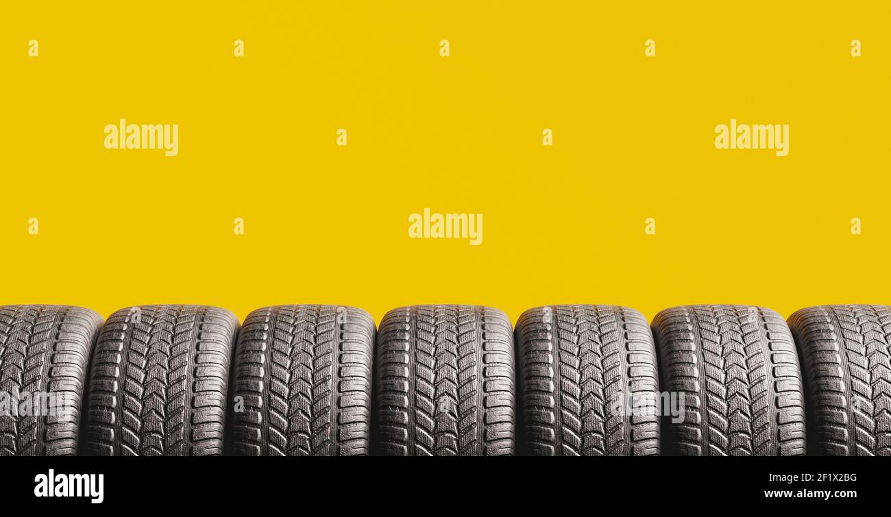 yellow background with tires peeking out from the bottom and space for ...