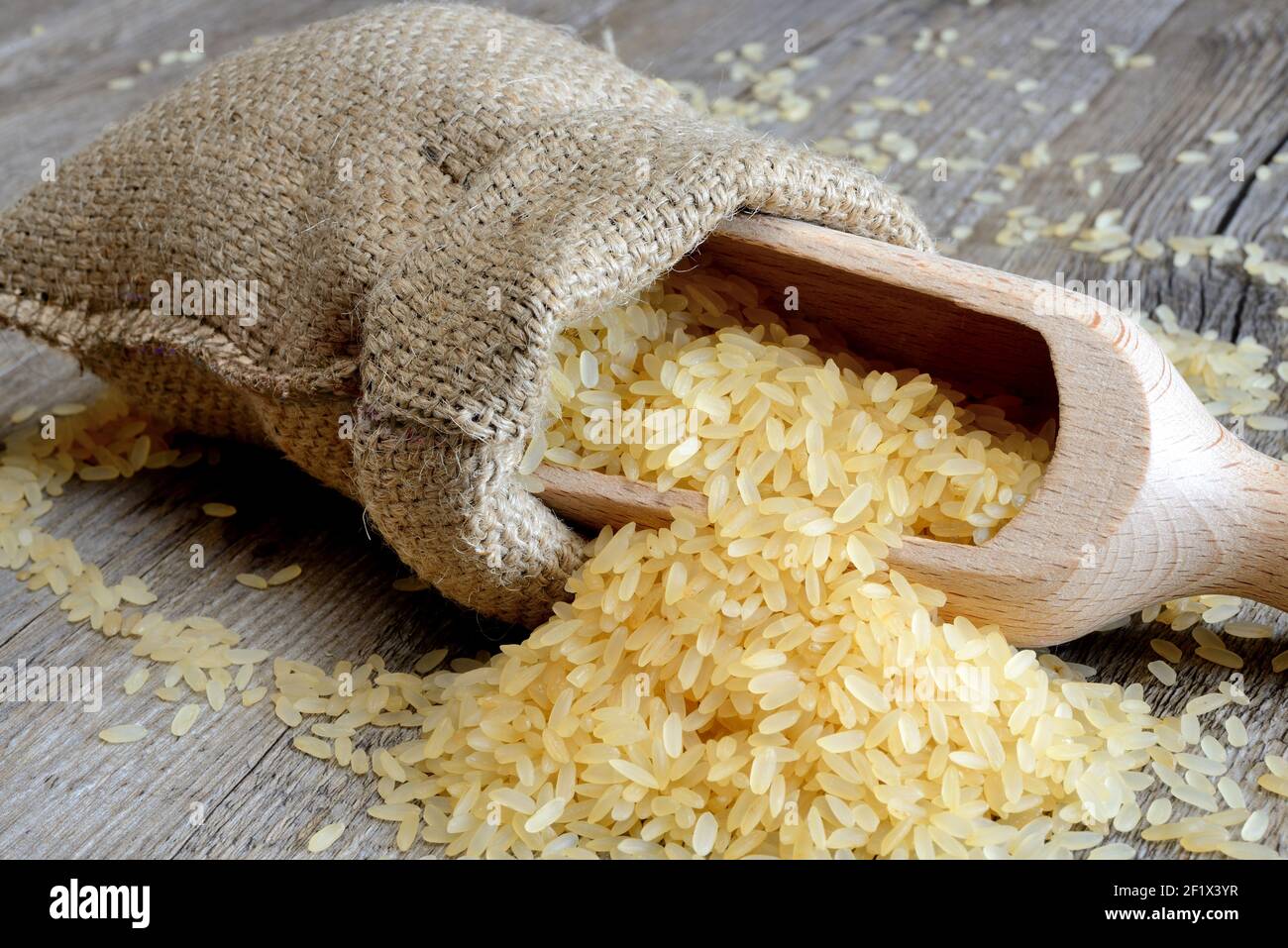 Rice in sack Stock Photo - Alamy