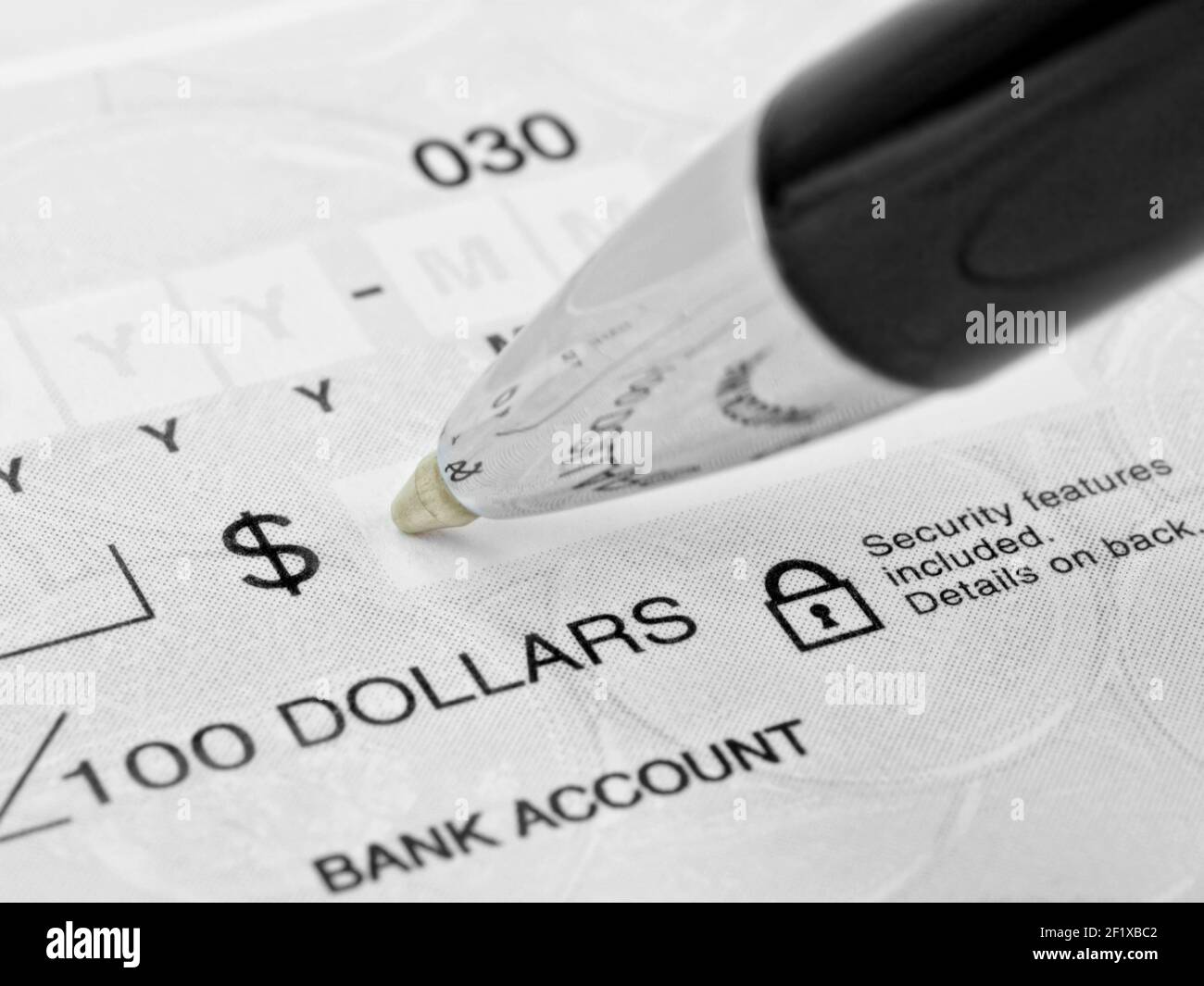 Pen on the Check Stock Photo - Alamy