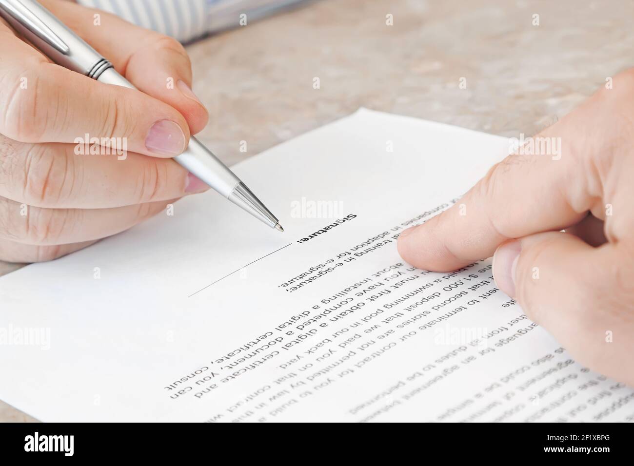 Signing a Document Stock Photo - Alamy
