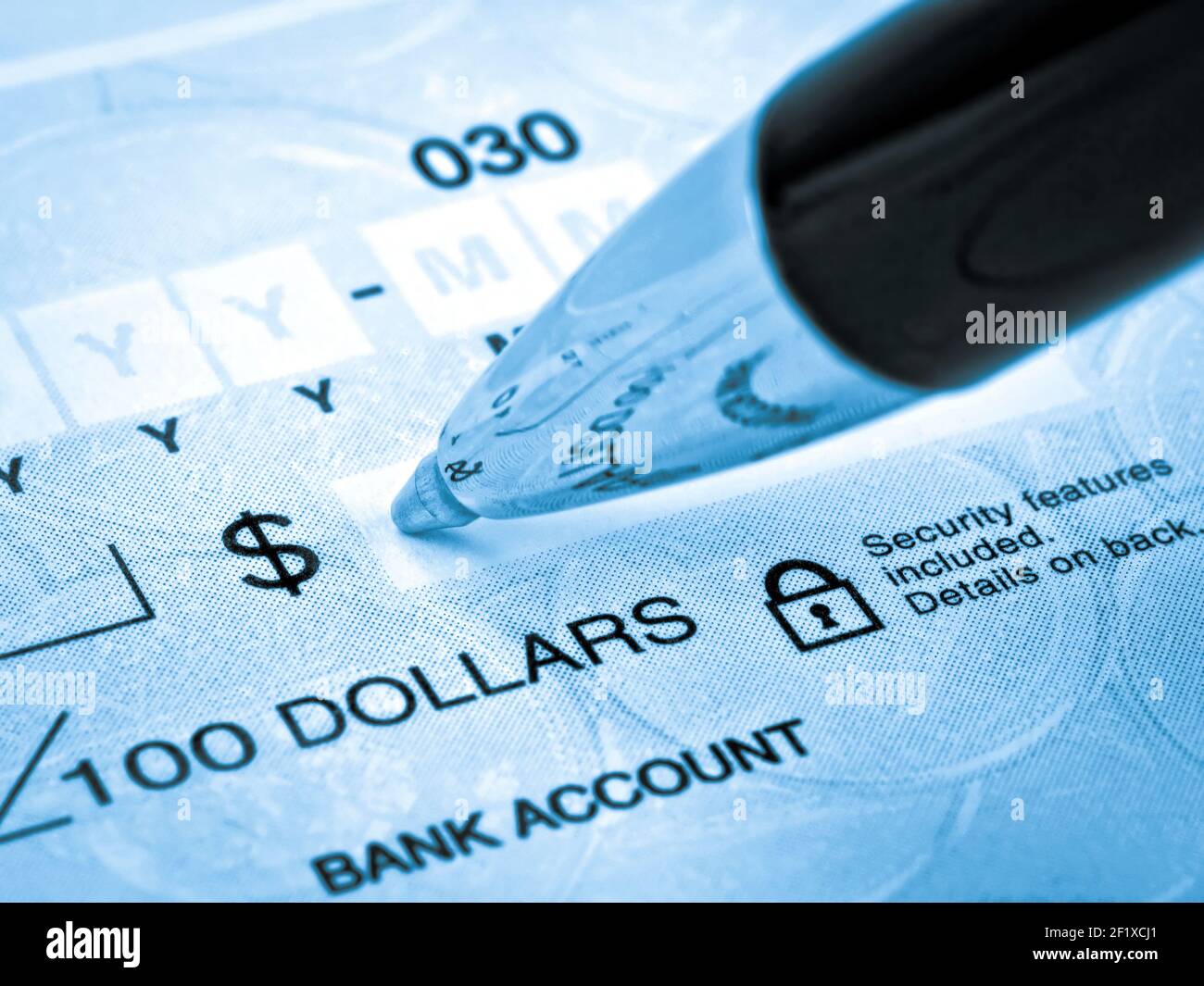 Pen on the Check Stock Photo - Alamy