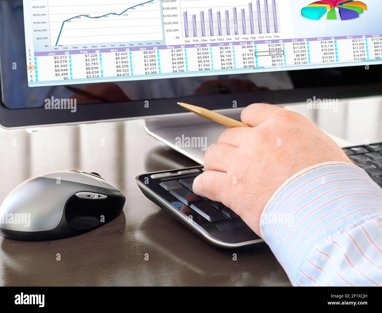 Man's Hand with Pen Typing at a Computer Keyboard Stock Photo - Alamy