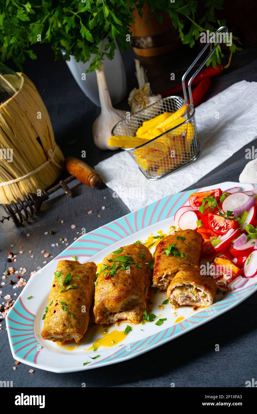 Vegetable roulade from roast pork loins with salads Stock Photo - Alamy