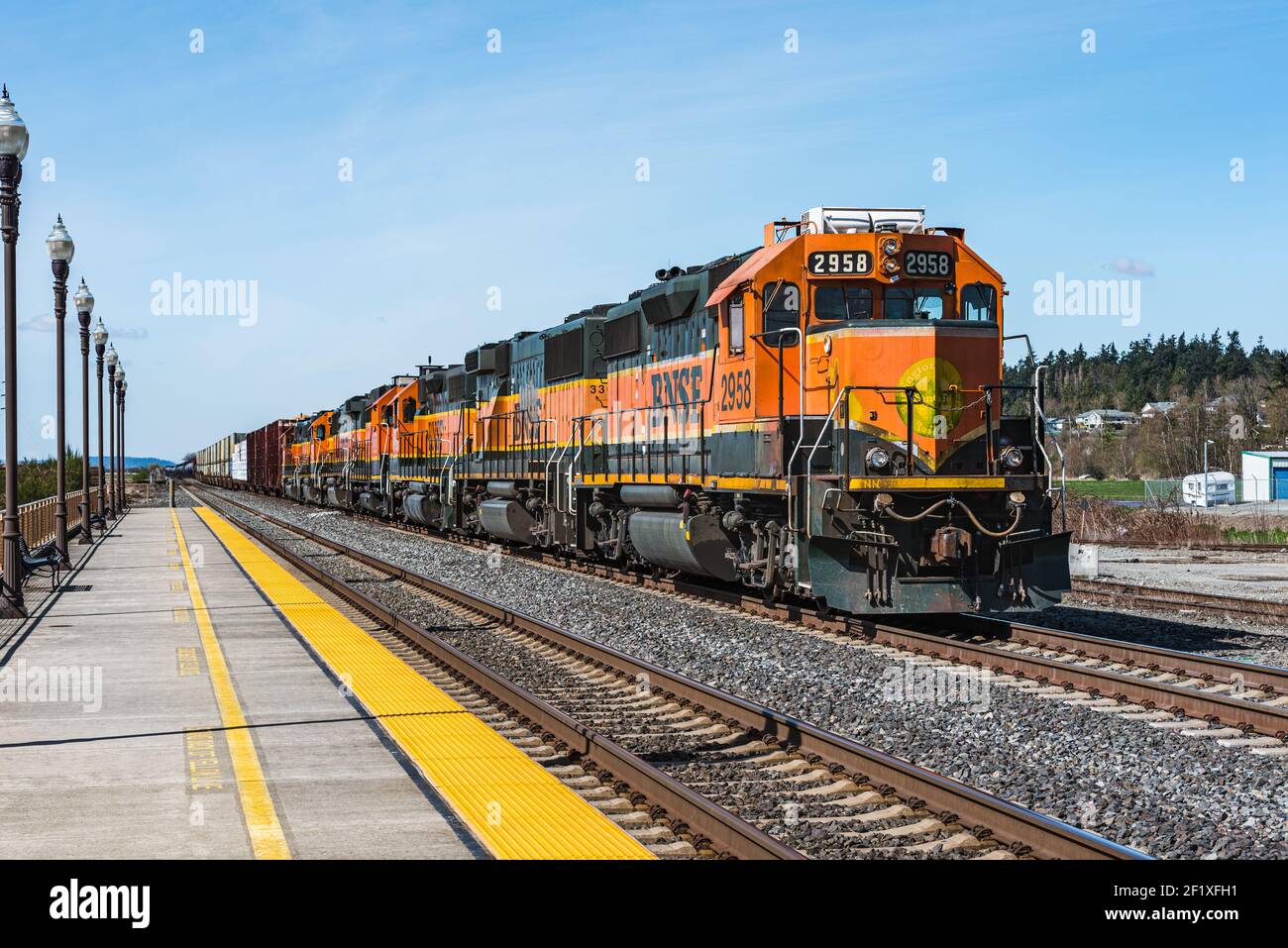 A large number of locomotives lead a BNSF freight train southbound through Stanwood in ...