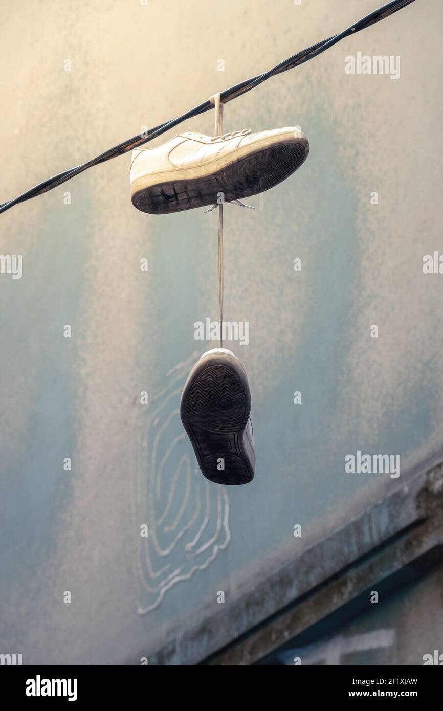 Shoes on a wire hi-res stock photography and images - Alamy
