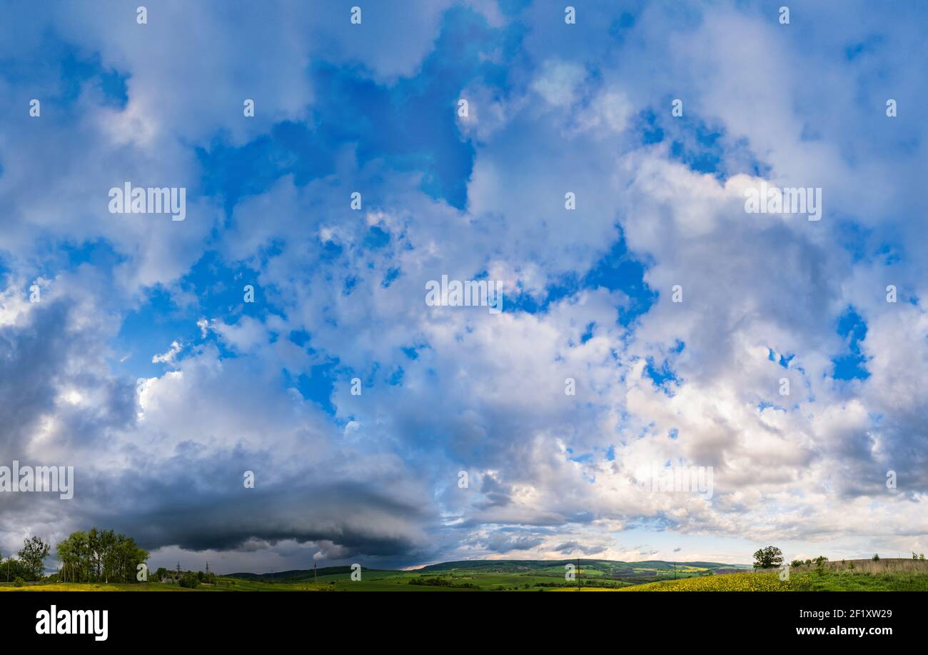 Dramatic cloudy sky with circular thunderstorm cloud over countryside ...