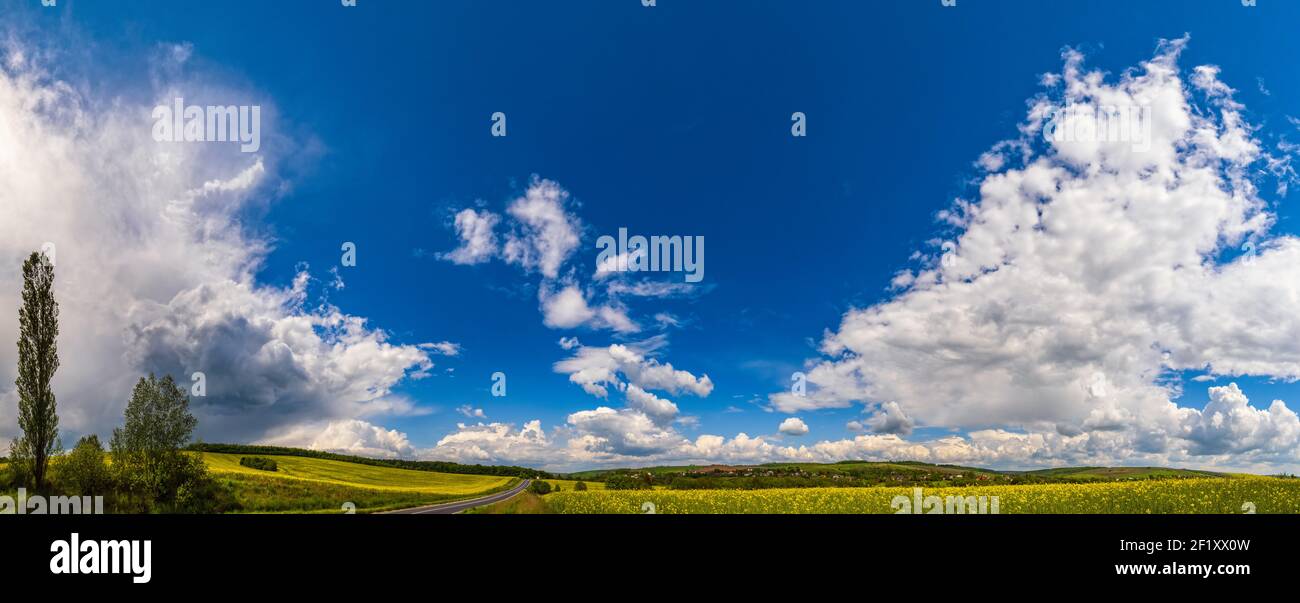 Cloudy sky over countryside hills Stock Photo - Alamy
