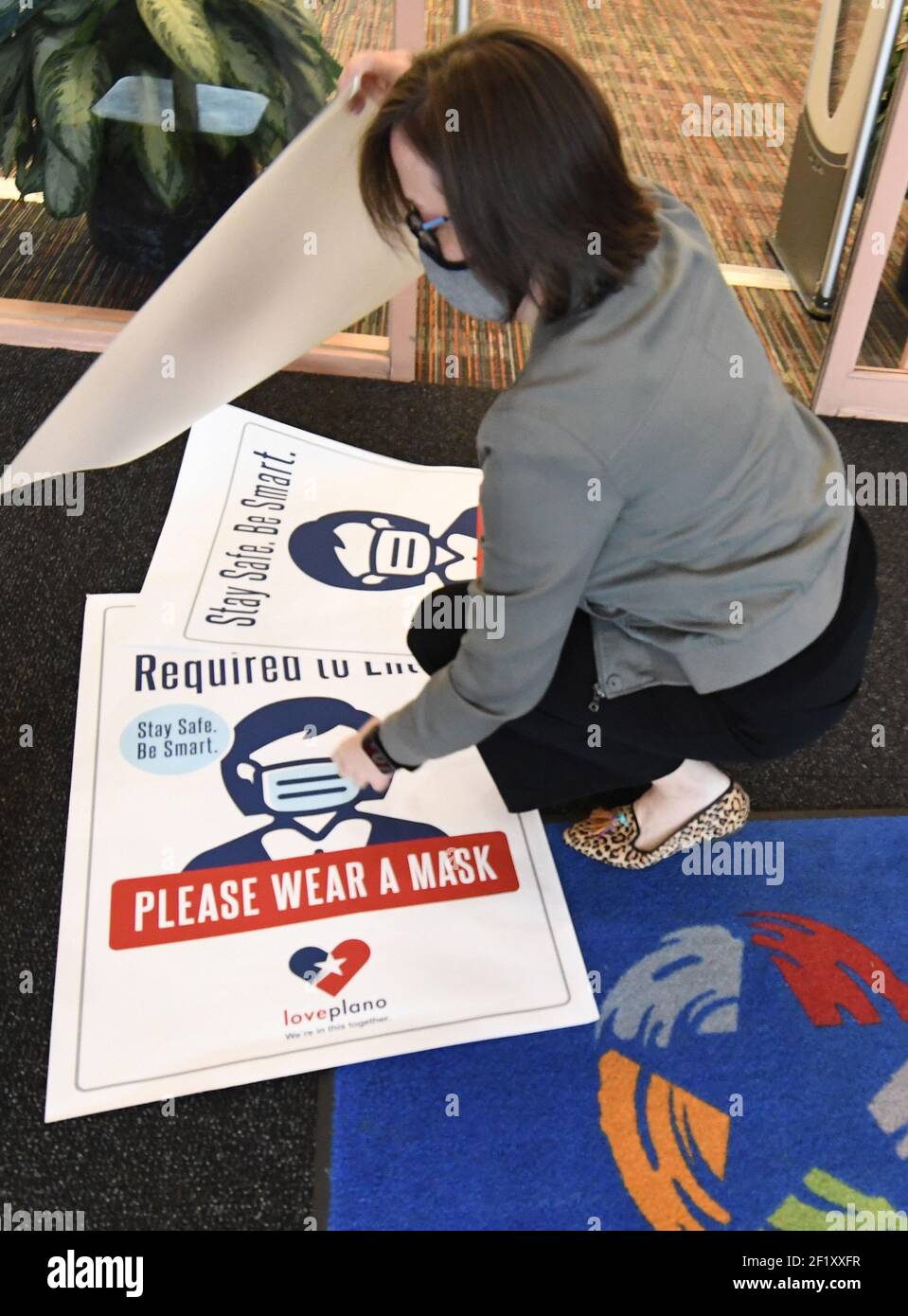 Dallas, United States. 09th Mar, 2021. Workers at a public library in ...