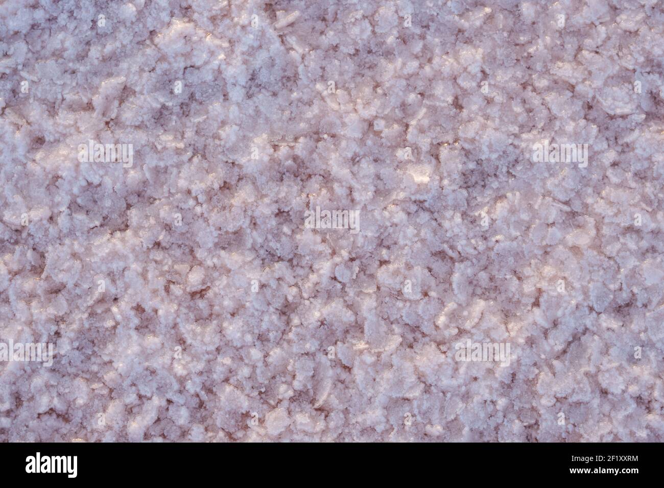 Crystals of pink salt natural background Stock Photo - Alamy