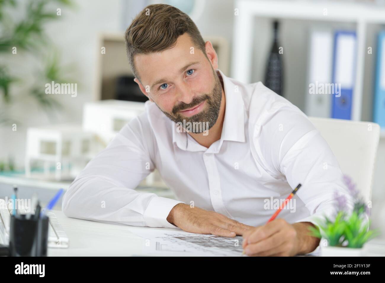 business man in office taking notes Stock Photo - Alamy
