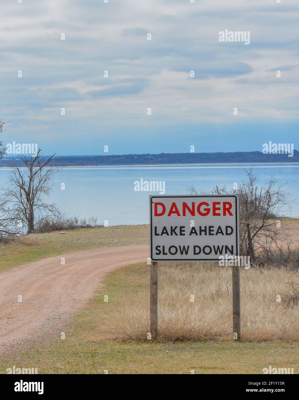 Danger, lake ahead, slow down sign at Lake Whitney State Park in Texas ...