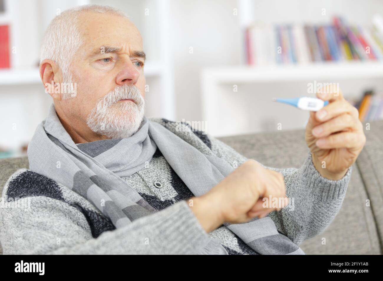 old man checking his temperature at home Stock Photo - Alamy