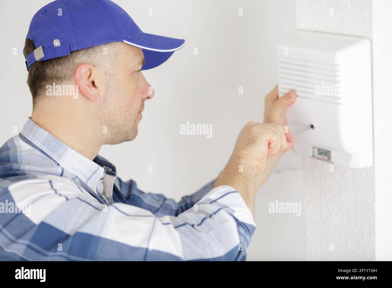 man during installation of hand-dryer Stock Photo - Alamy