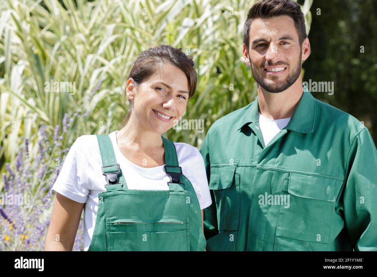 Garden center employee planting flower hi-res stock photography and ...