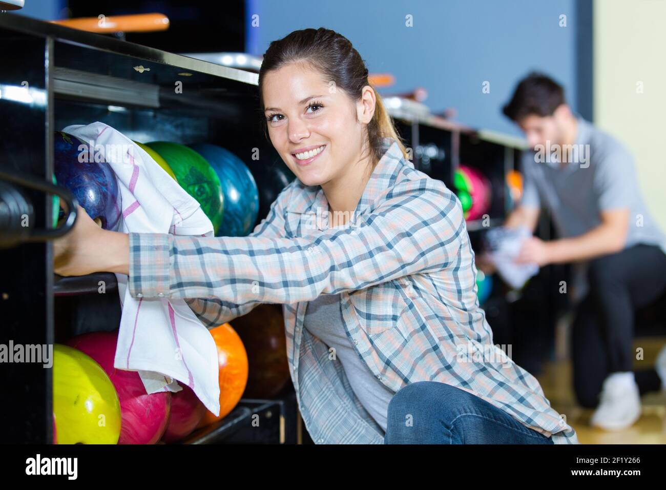 cleaning the bowling balls Stock Photo - Alamy