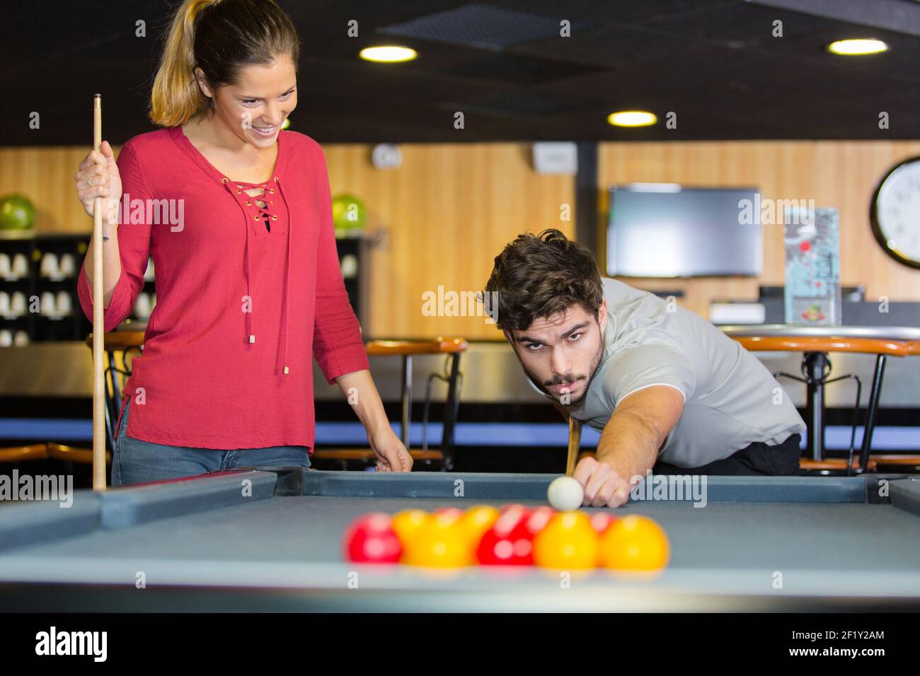beautiful couple dating and playing snooker Stock Photo - Alamy