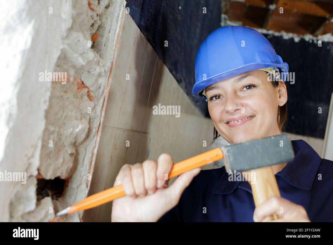 woman with hammer and chisel Stock Photo - Alamy